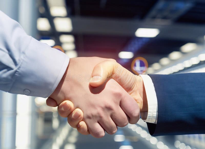 Handshake in a Modern Airport As a Sign of Cooperation Close-up Stock ...