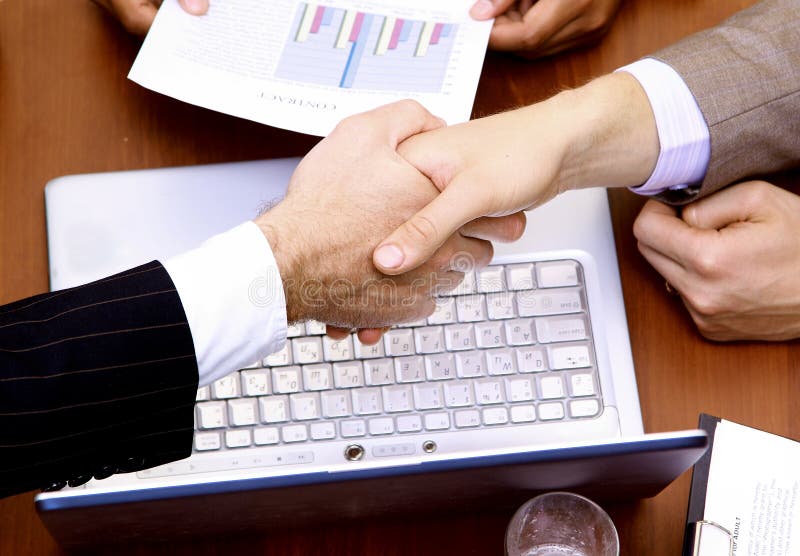 Sealing a Business Transaction with a Handshake Stock Photo - Image of ...