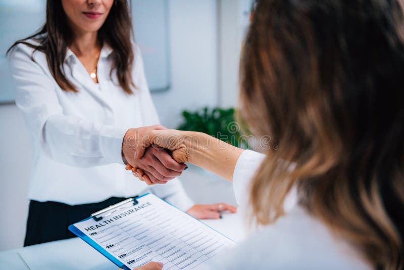 Handshake after Signing Health Insurance Form Stock Photo - Image of ...