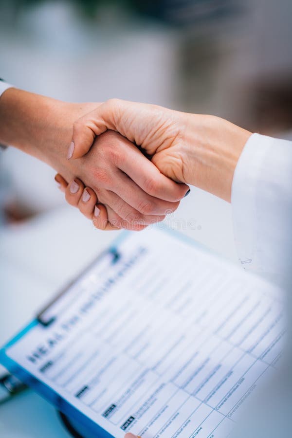 Handshake after Signing Health Insurance Form Stock Image - Image of ...