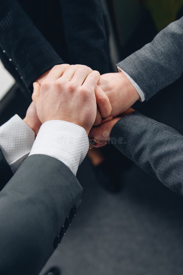 Handshake Three Hands of Businesspeople Stock Photo - Image of shaking ...
