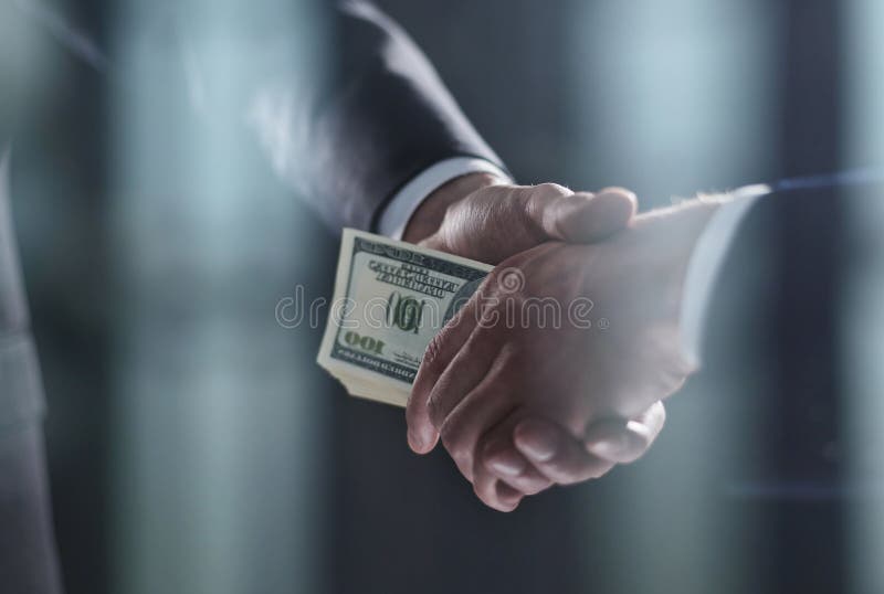 Handshake with the Transfer of Money on a Black Background Stock Image ...