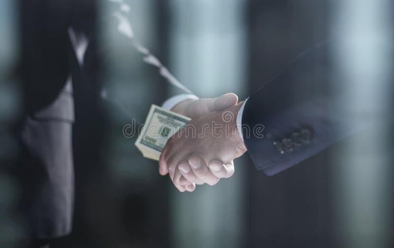 Handshake with the Transfer of Money on a Black Background Stock Image ...