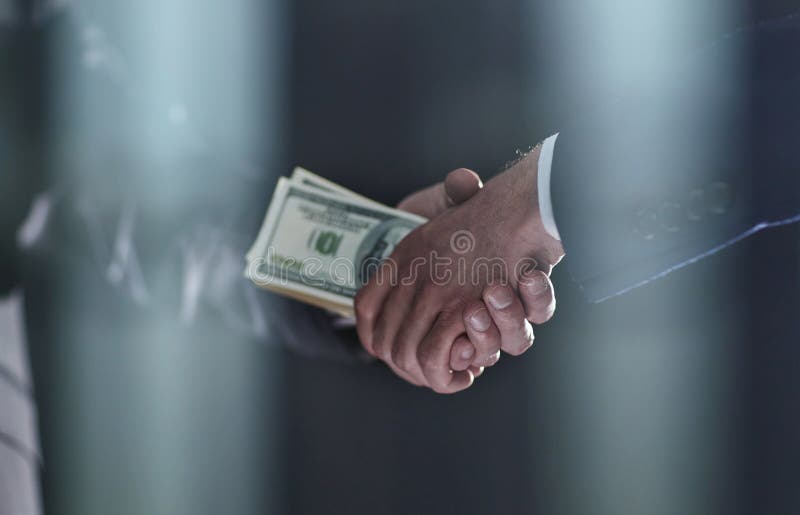 Handshake with the Transfer of Money on a Black Background Stock Image ...