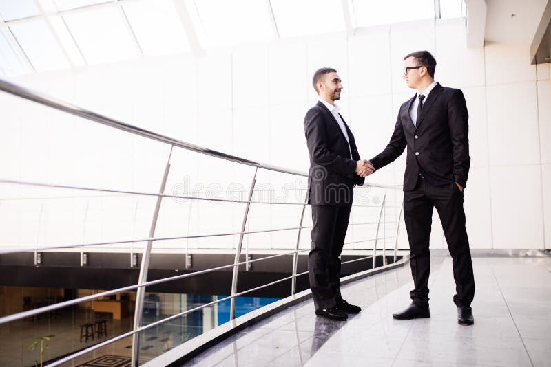 Handshake of Two Business Men Closing a Deal at the Office Stock Image ...