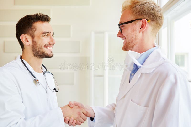 Doctors Welcome Patient To Consultation Stock Photo - Image of medicine ...