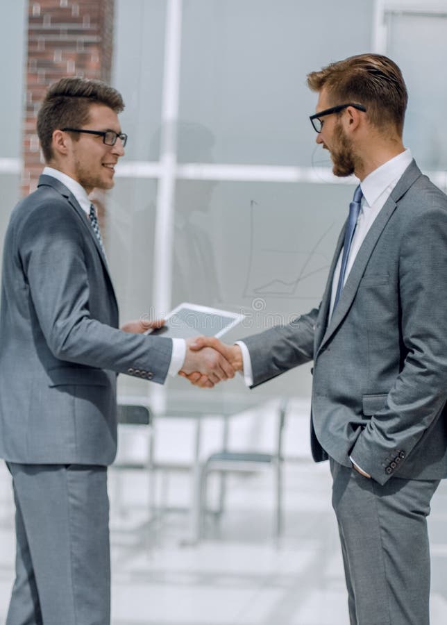 Handshake Two Employees Standing in the Office Stock Photo - Image of ...
