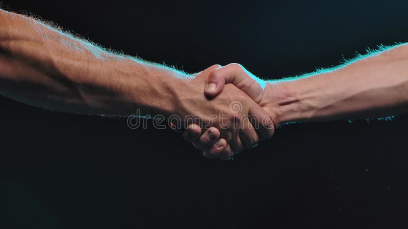 Handshake of Two Men with Bare Hands. Shot Against Black Background ...