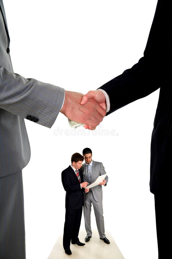 Handshake and Two Working Businessmen Stock Photo - Image of document ...