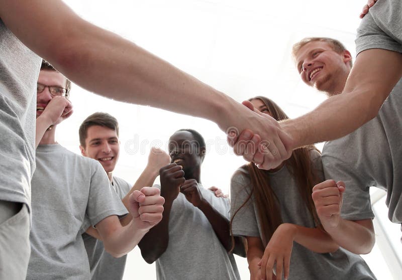 Handshake of Young People in a Circle of Friends Stock Image - Image of ...