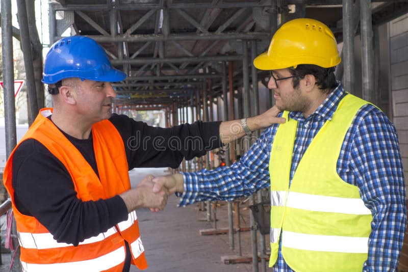 Handshaking at Construction Site Stock Image - Image of hands, engineer ...