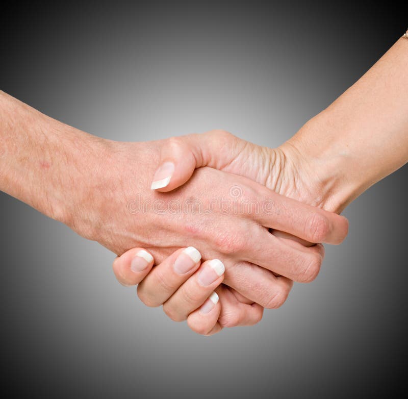Handshaking man and woman stock photo. Image of person - 16526268