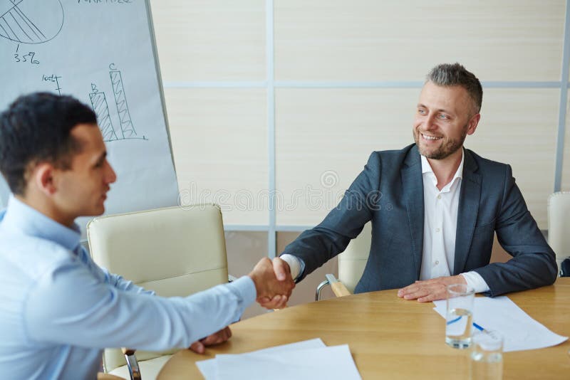 Handshaking with partner stock image. Image of handsome - 74547705