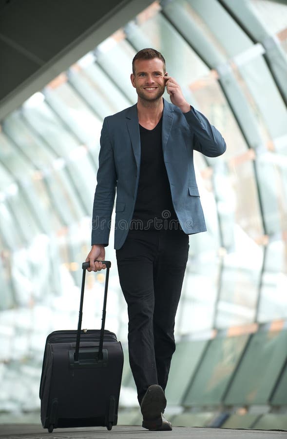 Handsom Man Walking in City with Cell and Suitcase Stock Photo - Image ...
