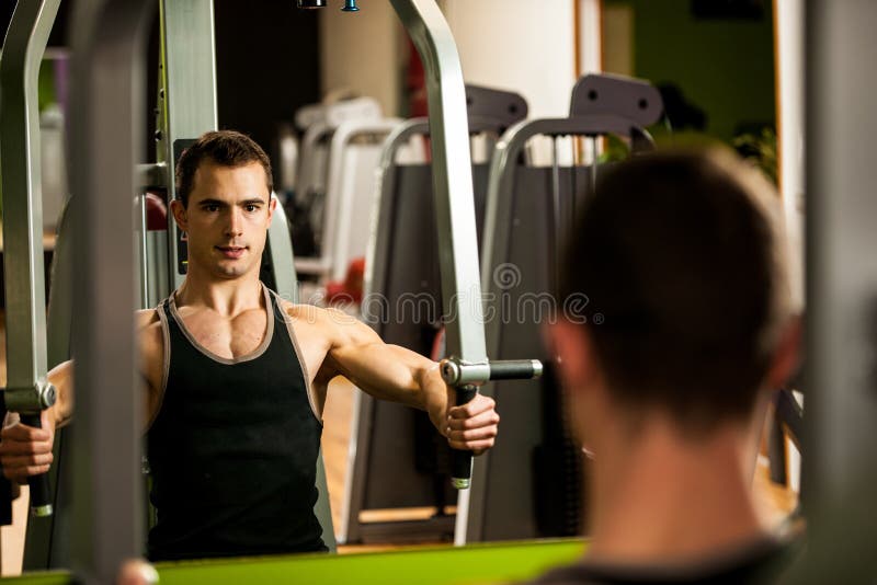 Handsom Young Man Workout in Fitness Gym Stock Photo - Image of strong ...