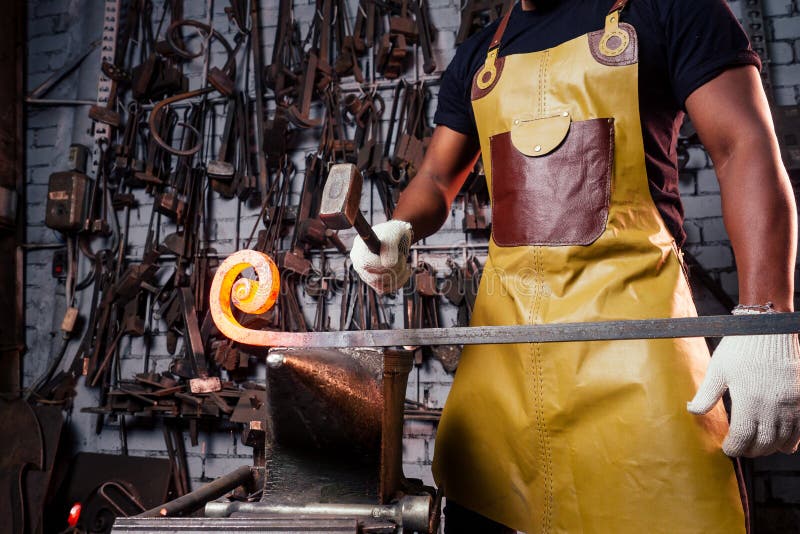 Handsome African American Blacksmith Male Worker Working in Workshop ...