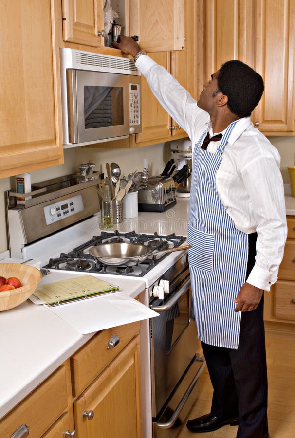 Handsome African-American Man Cooks in Kitchen Stock Image - Image of ...