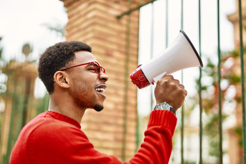 Handsome African American Young Man Outdoors Screaming through ...