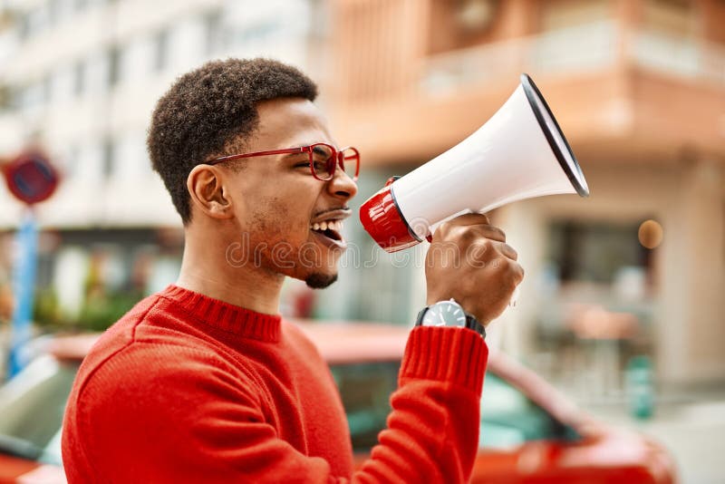 Handsome African American Young Man Outdoors Screaming through ...
