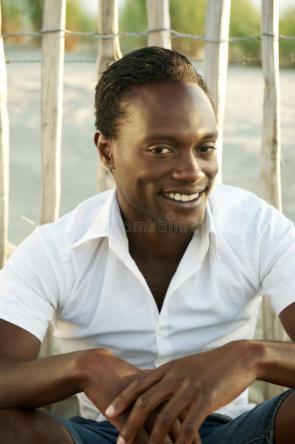 Handsome African Man Smiling Outdoors Stock Image - Image of confidence ...