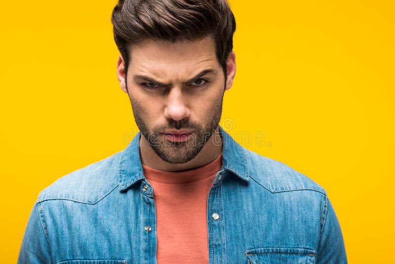 Aggressive Man Looking at Camera Isolated on Yellow Stock Photo - Image ...
