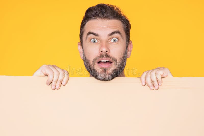 Handsome Amazed Man Holding Empty Board and Pointing Finger on Studio ...