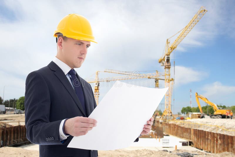 Handsome Architect Man in Builder Helmet at Construction Site Stock ... Handsome Architect Man in Builder Helmet at Construction Site Stock ...
