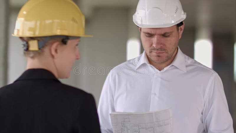 Handsome Architect with Supervisor of the Construction Site Show Place ...