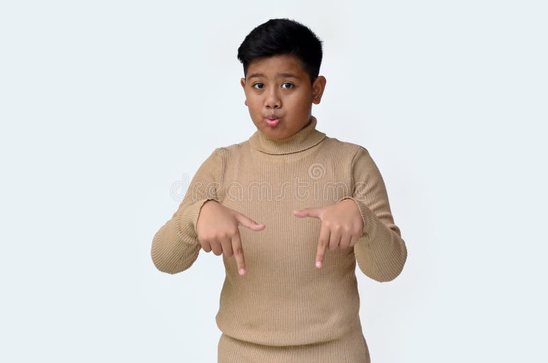 Handsome Asian Boy with Pointing To the Bottom Expression. Stock Image ...