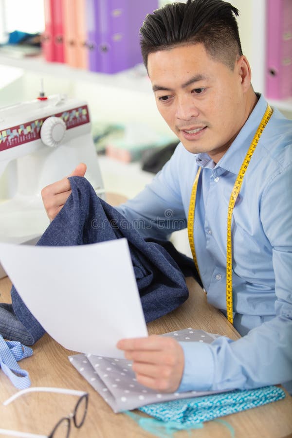 Handsome Asian Fashion Designer Sewing with Sewing Machine Stock Photo ...