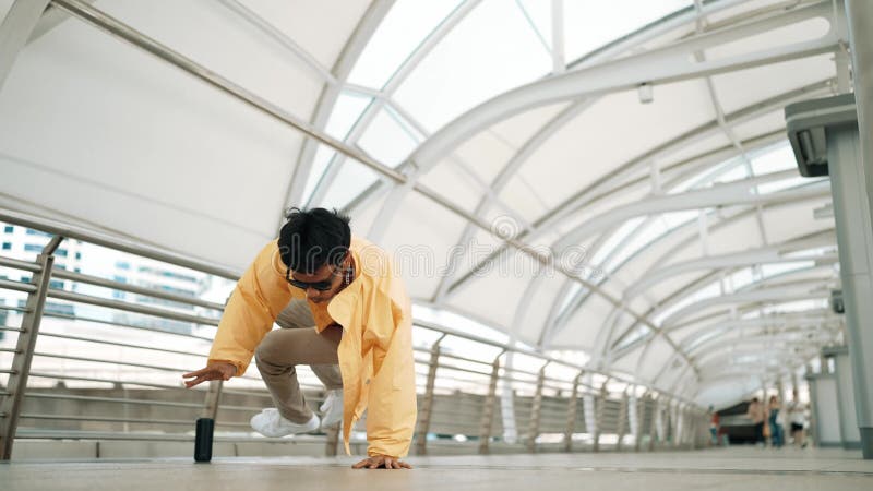 Handsome Asian Hipster Dancing while Using Head Spin at Corridor ...