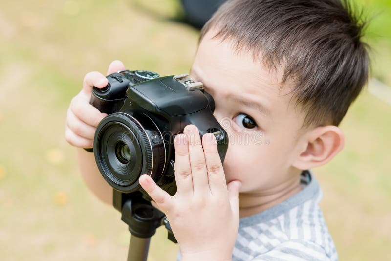 A Handsome Asian Kid Take a Photo by DSLR Camera Stock Photo - Image of ...