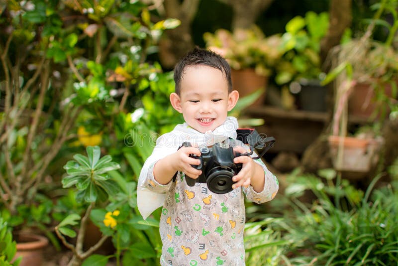 Handsome Asian Kid Take a Photo by Digital Camera Stock Photo - Image ...