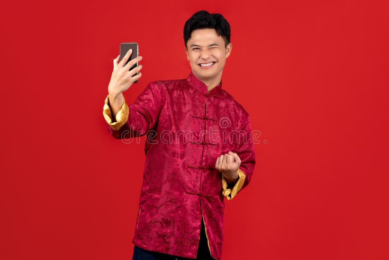 Handsome Asian Man Expressing Satisfaction with Using Smartphone ...