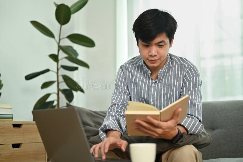 Handsome Asian Man Freelancer Using Laptop and Checking His Working ...