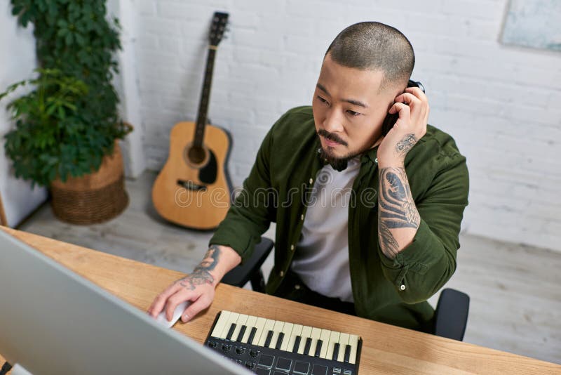 A Handsome Asian Man Plays a Stock Photo - Image of ...