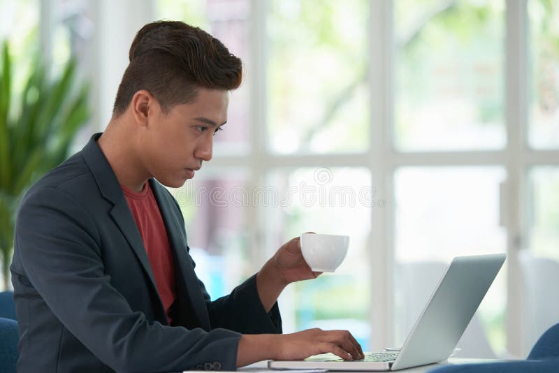 Handsome Asian Man Using Laptop at Home Stock Image - Image of ...