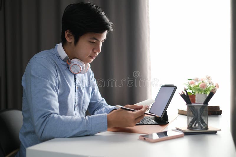 Handsome Asian Man Working with Computer Tablet at Home Office Stock ...
