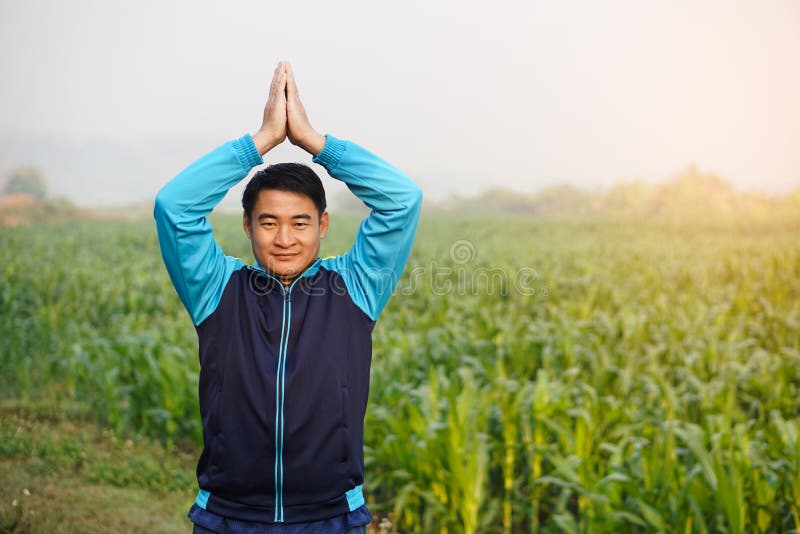 Handsome Asian Man Workouts Outdoor, Body Stretching. Warm Up before or ... Handsome Asian Man Workouts Outdoor, Body Stretching. Warm Up before or ...