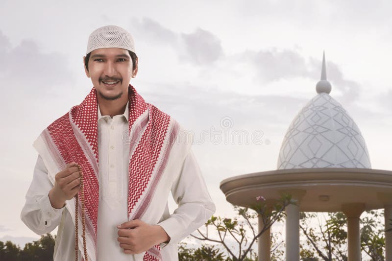 Handsome Asian Muslim Man with White Cap Holding Prayer Beads Stock ...