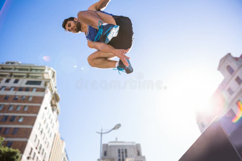 Handsome Athlete Jumping Off the Column Stock Photo - Image of ...