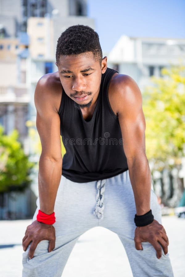 A Handsome Athlete Looking at the Floor Stock Image - Image of ...