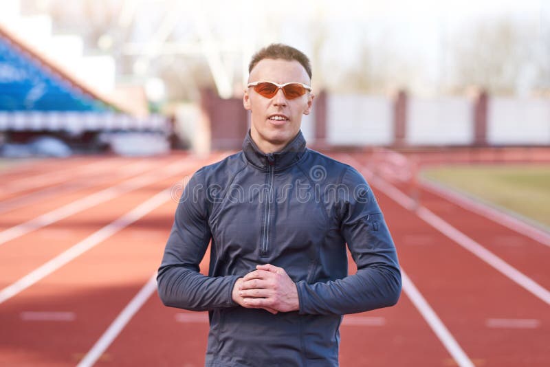 Handsome Athletic Man Posing on the Running Track of the Stadium Stock ...
