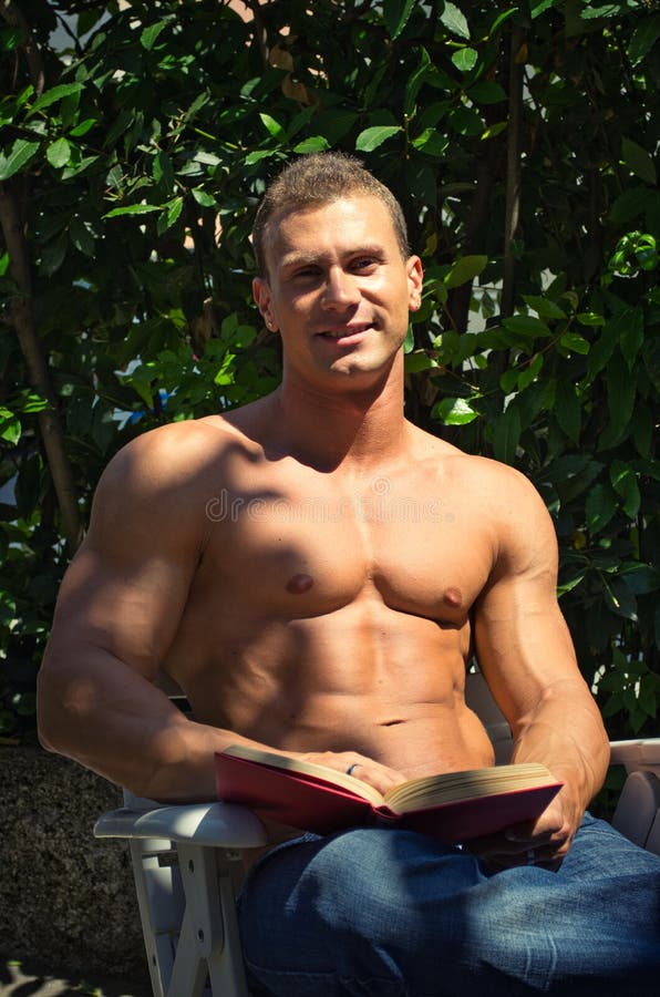 Handsome Athletic Young Man Reading Book Outside Stock Image - Image of ...