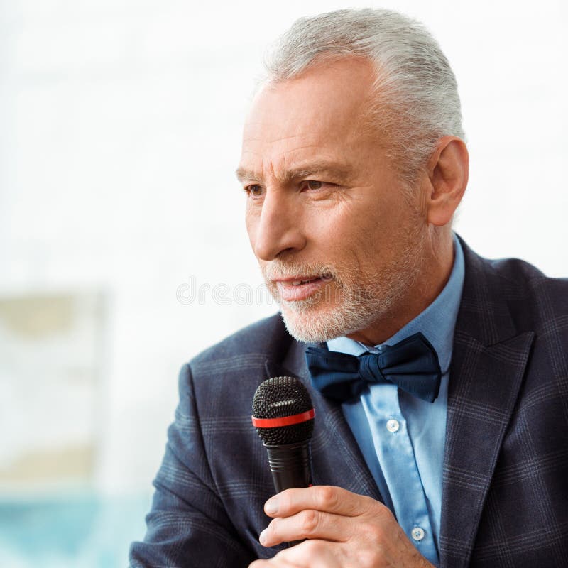 Handsome Auctioneer in Suit Talking with Stock Photo - Image of ...