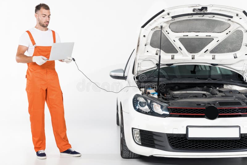 Handsome Auto Mechanic Checking Broken Car with Laptop Stock Image ...