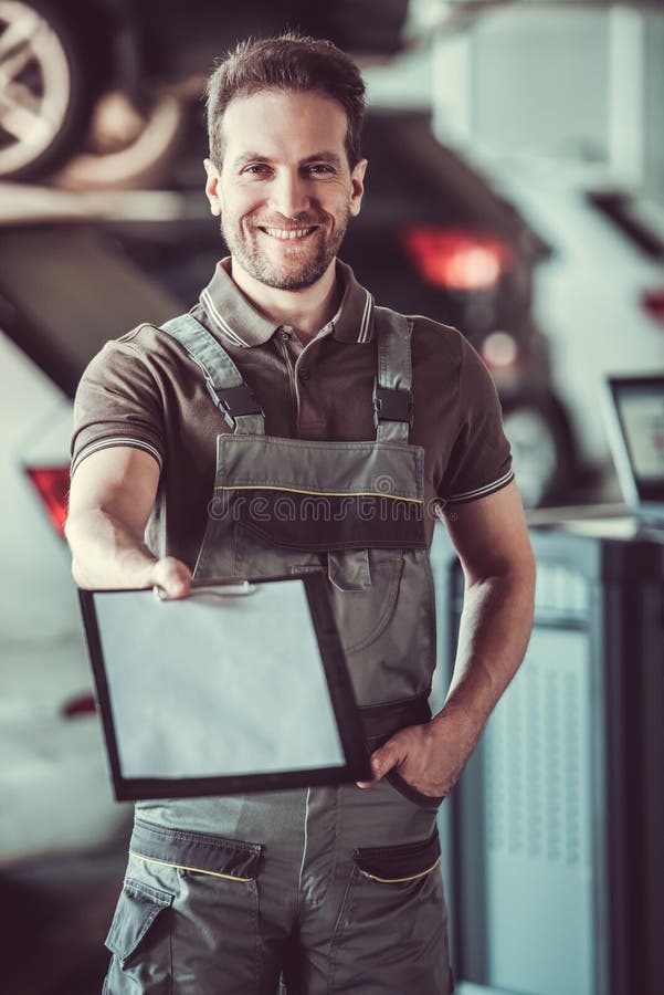 Handsome Auto Service Worker Stock Photo - Image of caucasian, notes ...
