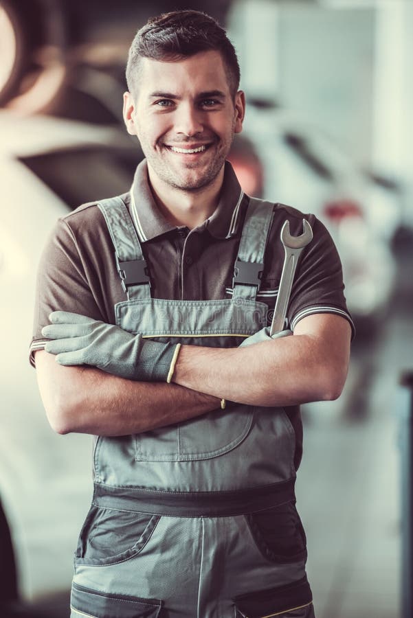 Handsome Auto Service Worker Stock Image - Image of smile, automotive ...