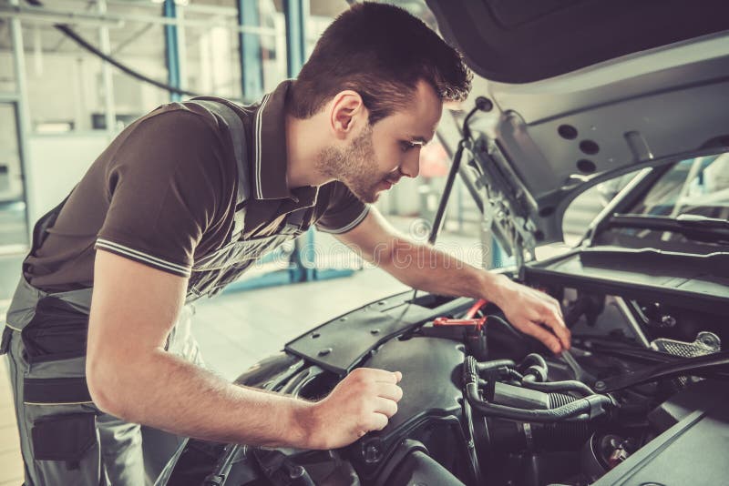 Handsome Auto Service Worker Stock Image - Image of caucasian, garage ...