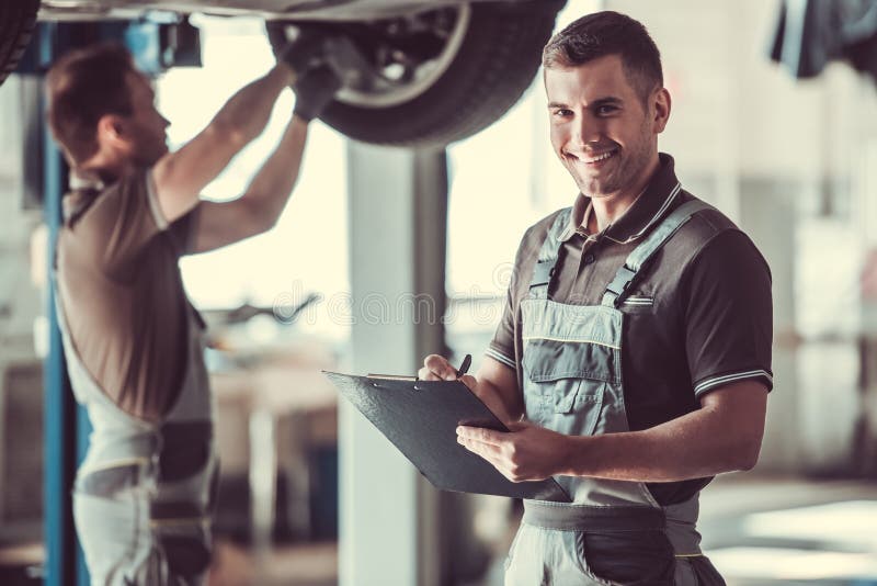 Handsome Auto Service Workers Stock Image - Image of shop, safety: 90925491